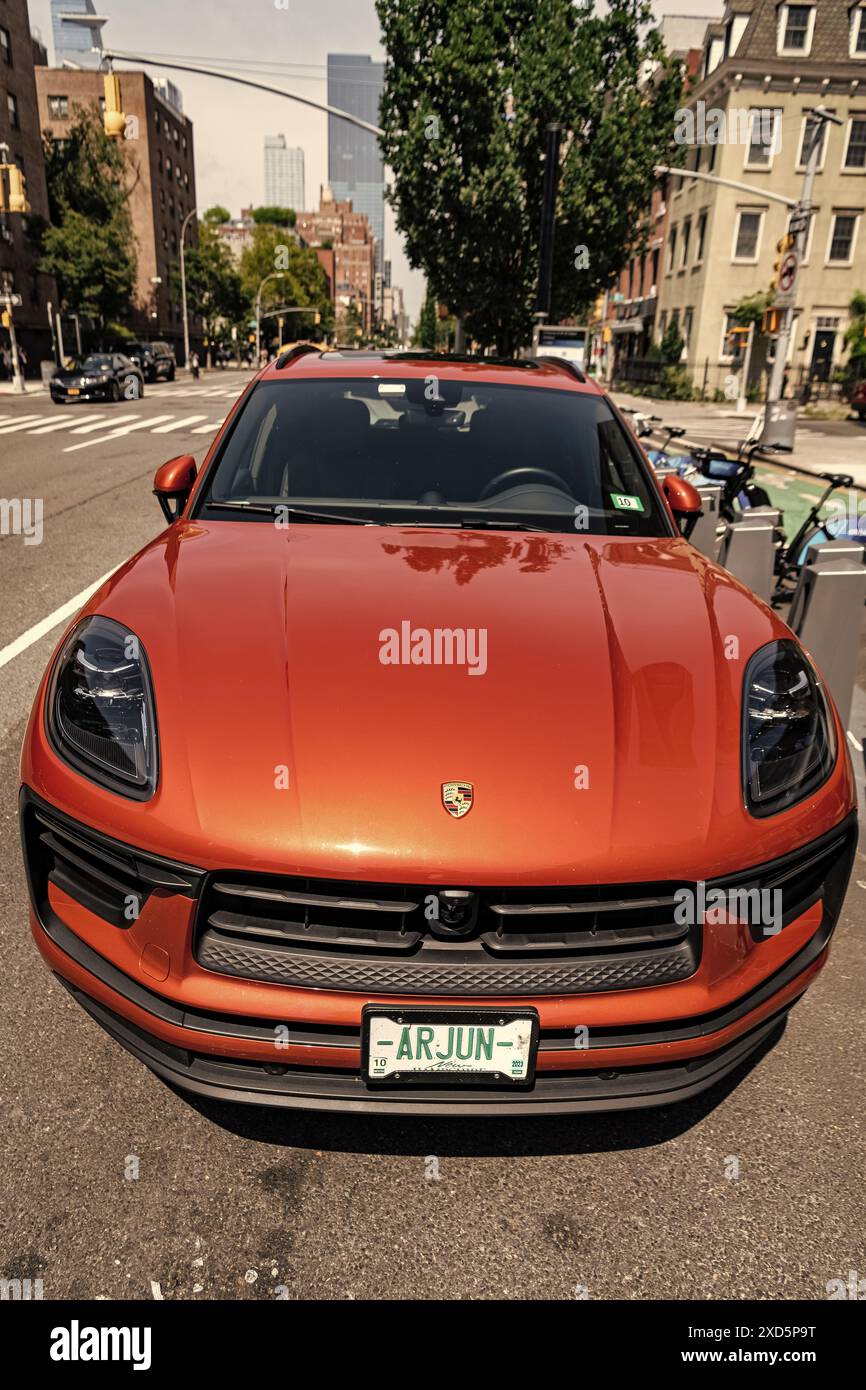 New York City, USA - August 05, 2023: 2023 Porsche Macan T SUV Ruby red ...