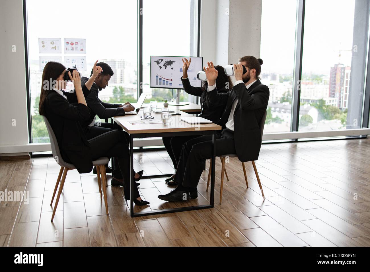 Business team using virtual reality headsets in office meeting Stock ...