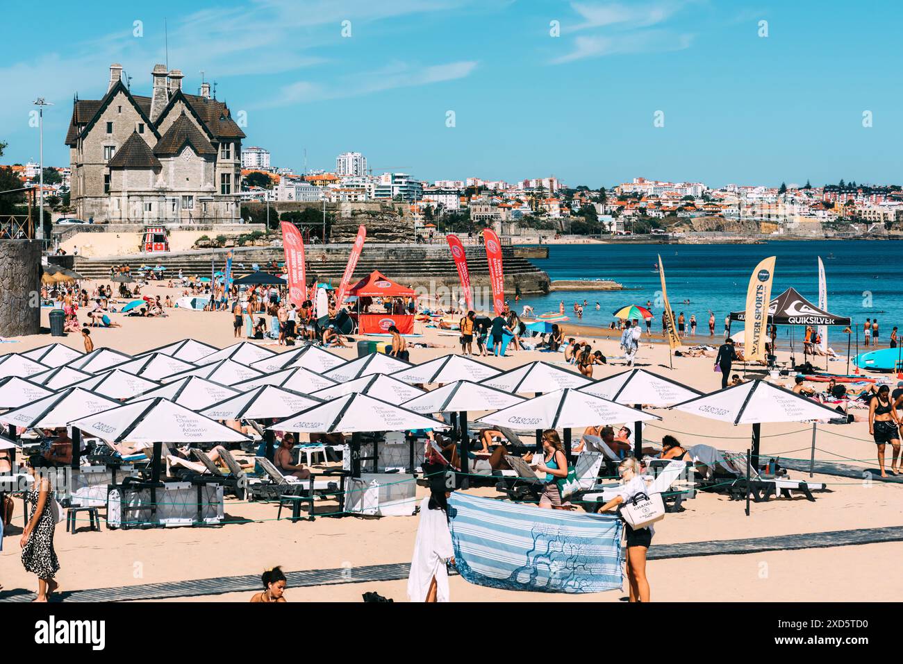 People relaxing at Duquesa beach in Cascais, Portugal on the Portuguese ...