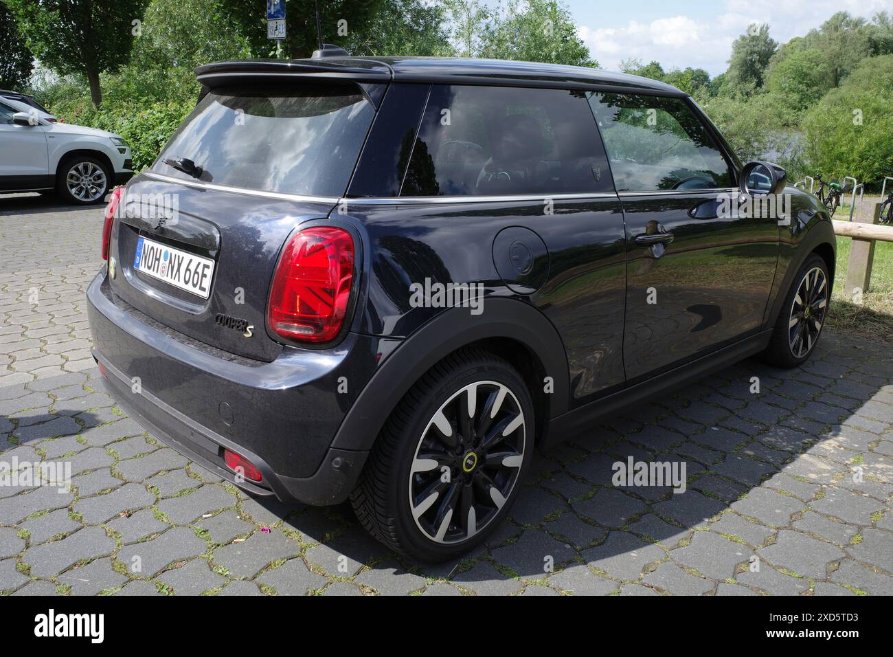 Nordhorn, Germany - June 9 2024 A parked black all electric mini cooper ...