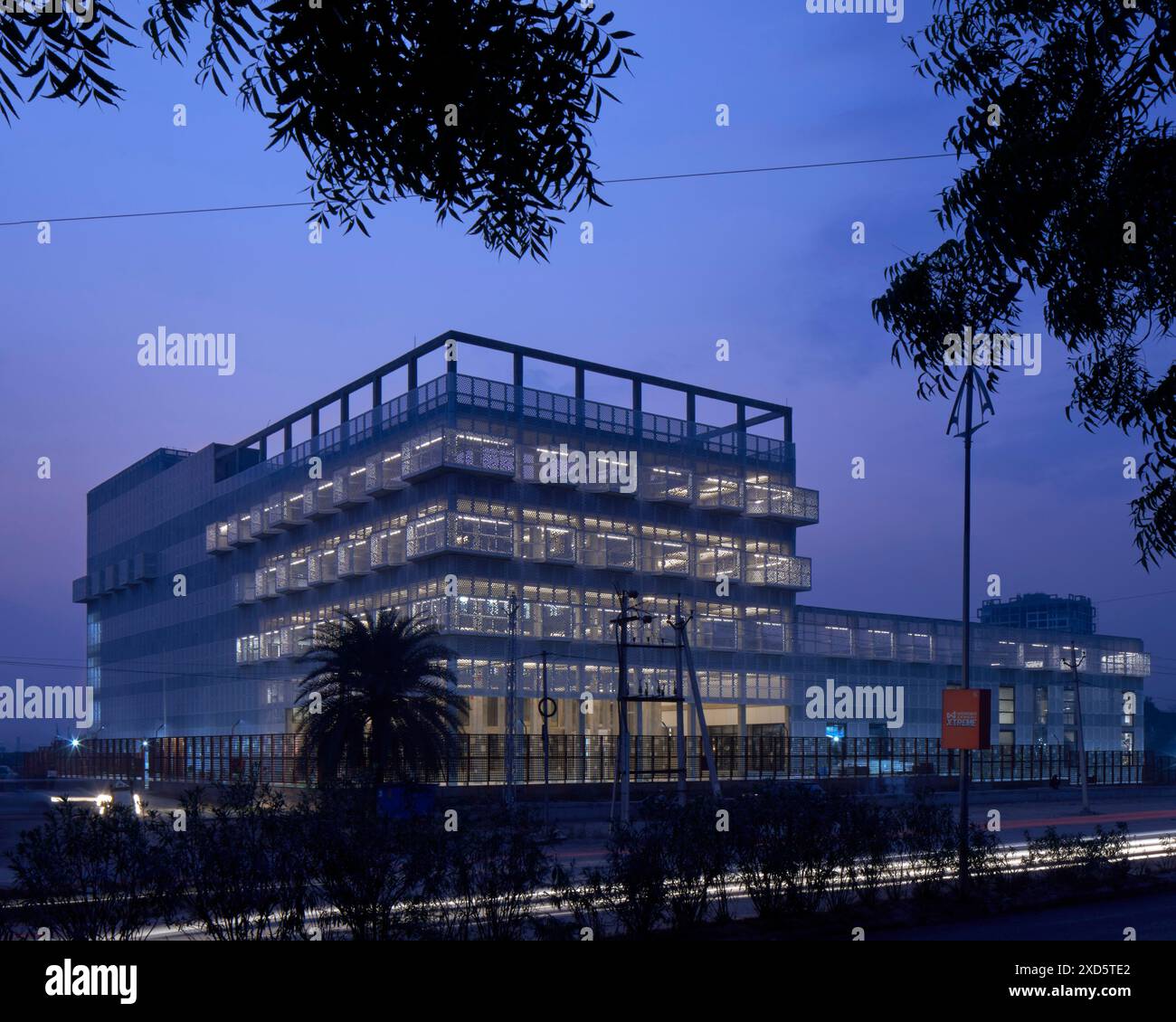 Elevated view of discovery centre in context at dusk. Third Space ...