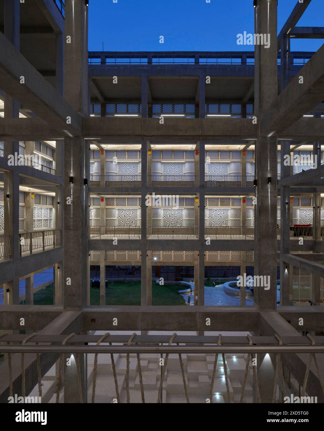 View across courtyard at dusk. Third Space, Udaipur, India. Architect ...