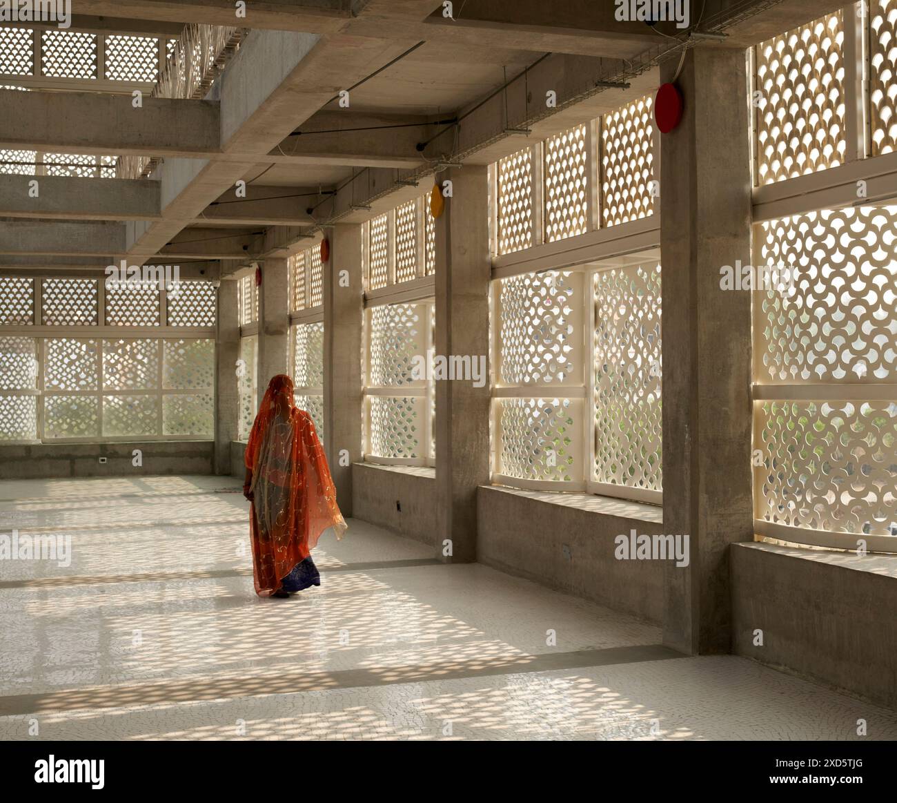 Figure walking along corridor with Jali screens. Third Space, Udaipur ...