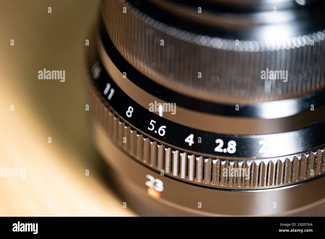 Close-up of a camera lens showing aperture and focal length markings ...