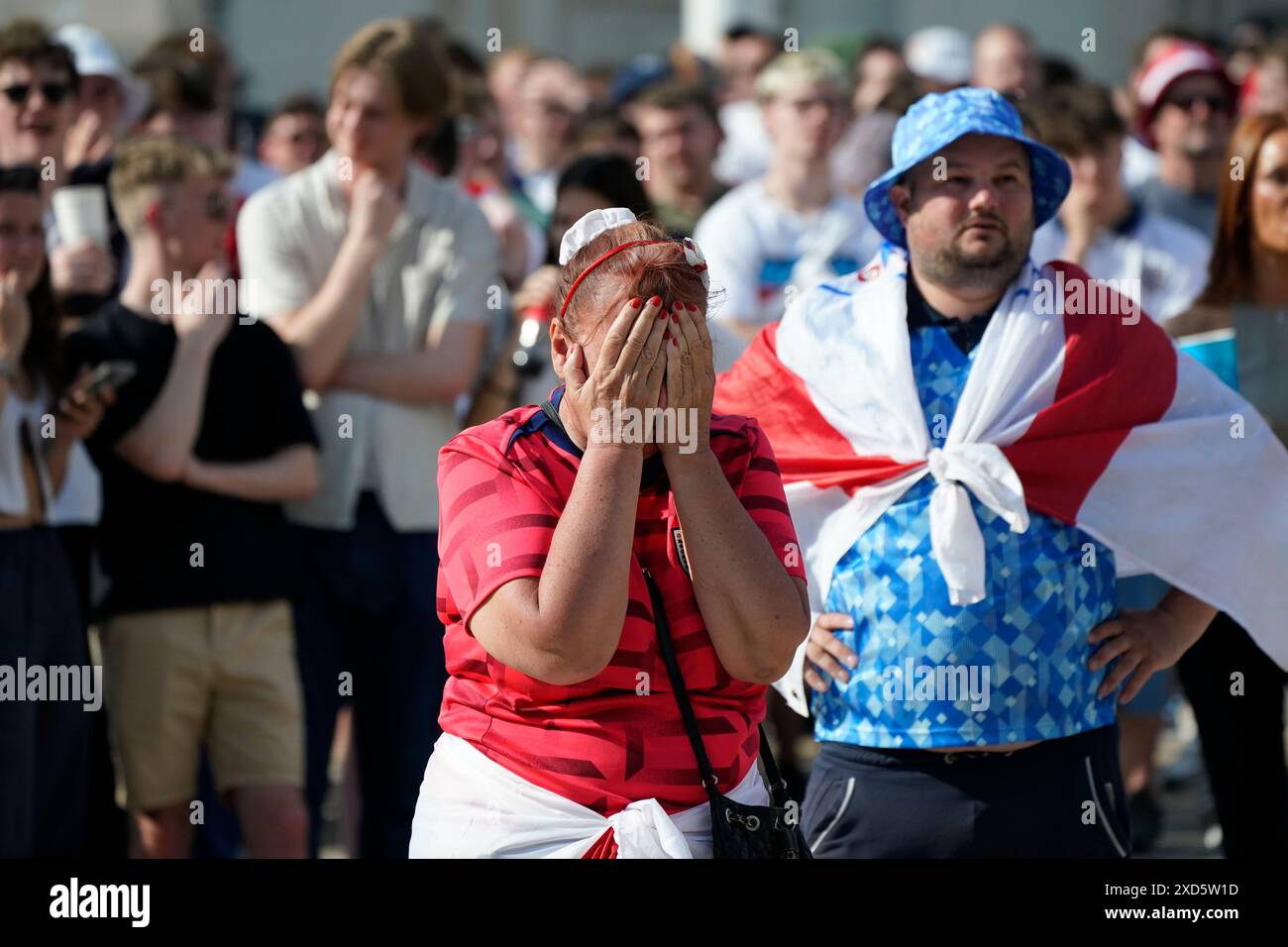 Dejected England fans at the Millennium Square in Leeds watching the ...