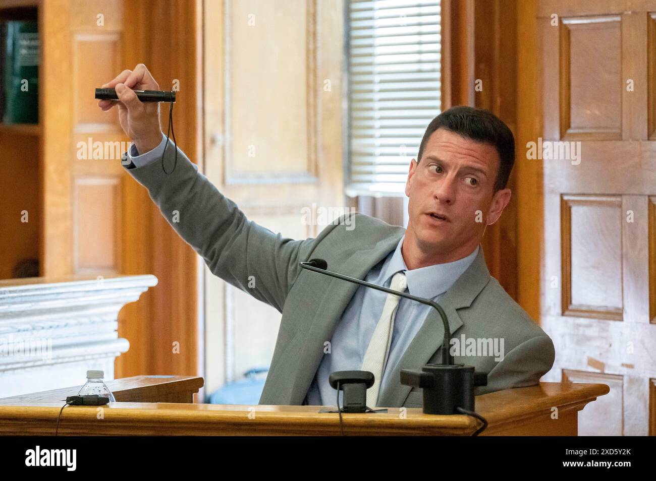 Witness State Trooper Nicholas Guarino points to evidence on screen ...