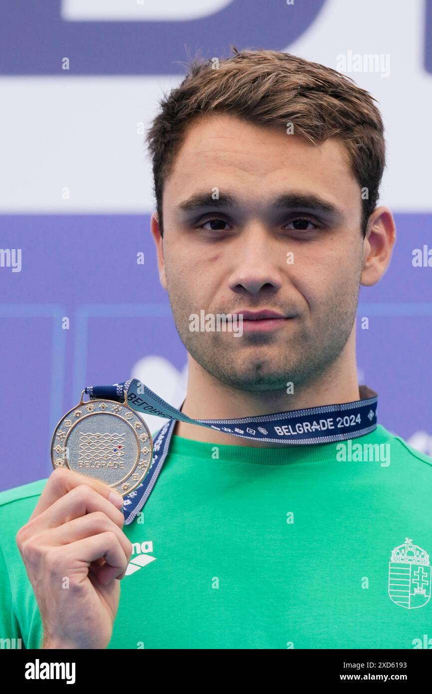Winner Kristof Milak of Hungary poses during the medal ceremony for the ...
