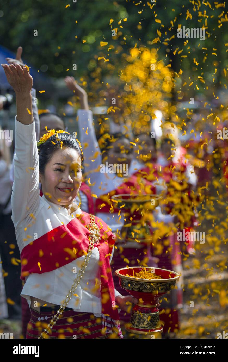Thai performers wearing traditional costumes perform the Lanna dance ...
