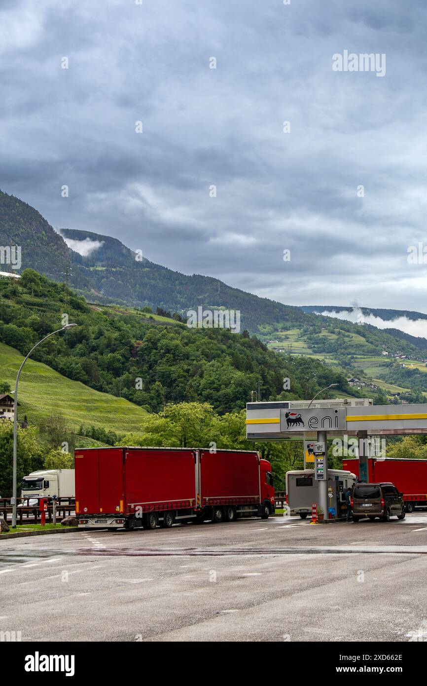 Trucks and vehicles refueling at an ENI gas station on the A22 highway ...