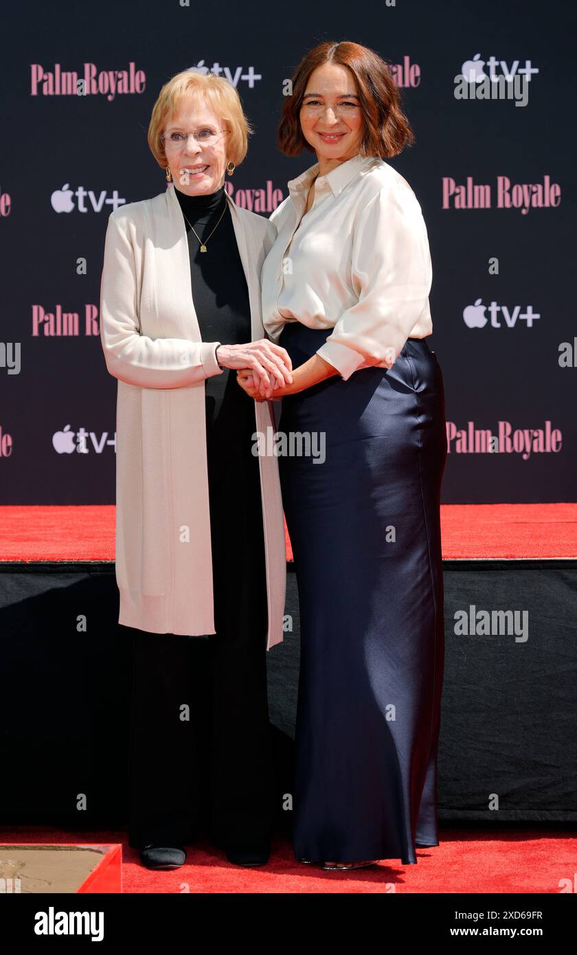 Comedian Carol Burnett, left, poses with actor Maya Rudolph during a ...