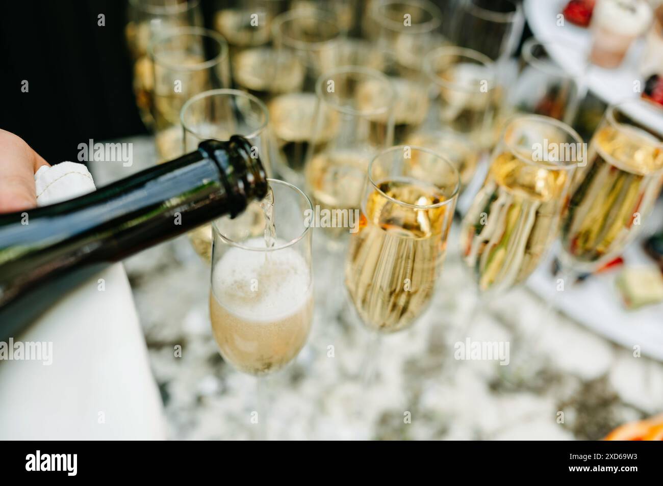 Champagne in glasses at a special event, ready for celebration, looks ...