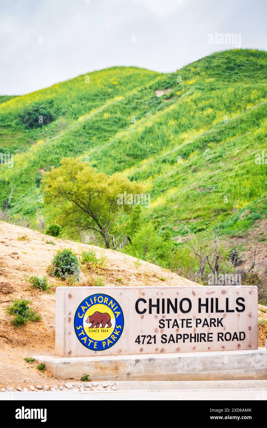 Sign in front of green hills at Chino HIlls State Park in California ...