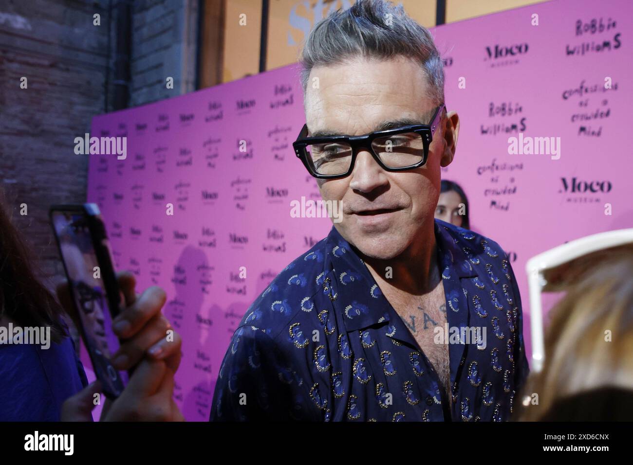 Singer Robbie Williams poses at the photocall of the exhibition ...