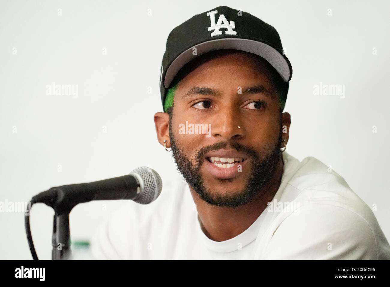 Kyree King responds to questions during a news conference before the U ...