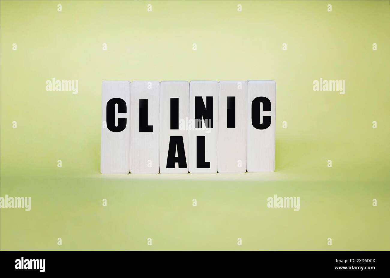 On a yellow background, the word CLINICAL on wooden cubes Stock Photo ...