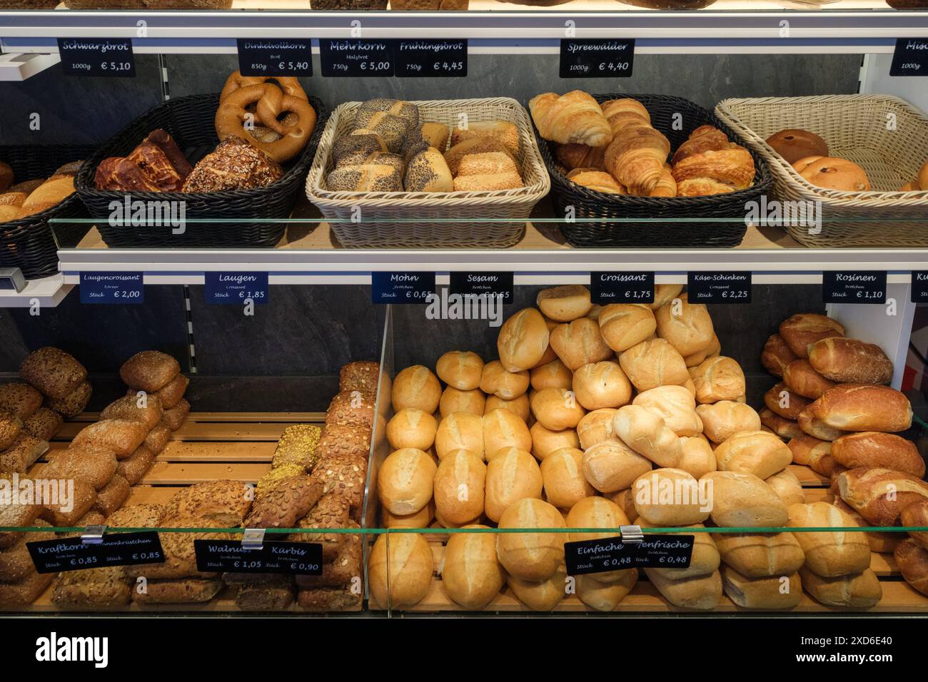 Freshly baked bread rolls lie in the display of a bakery Stock Photo ...
