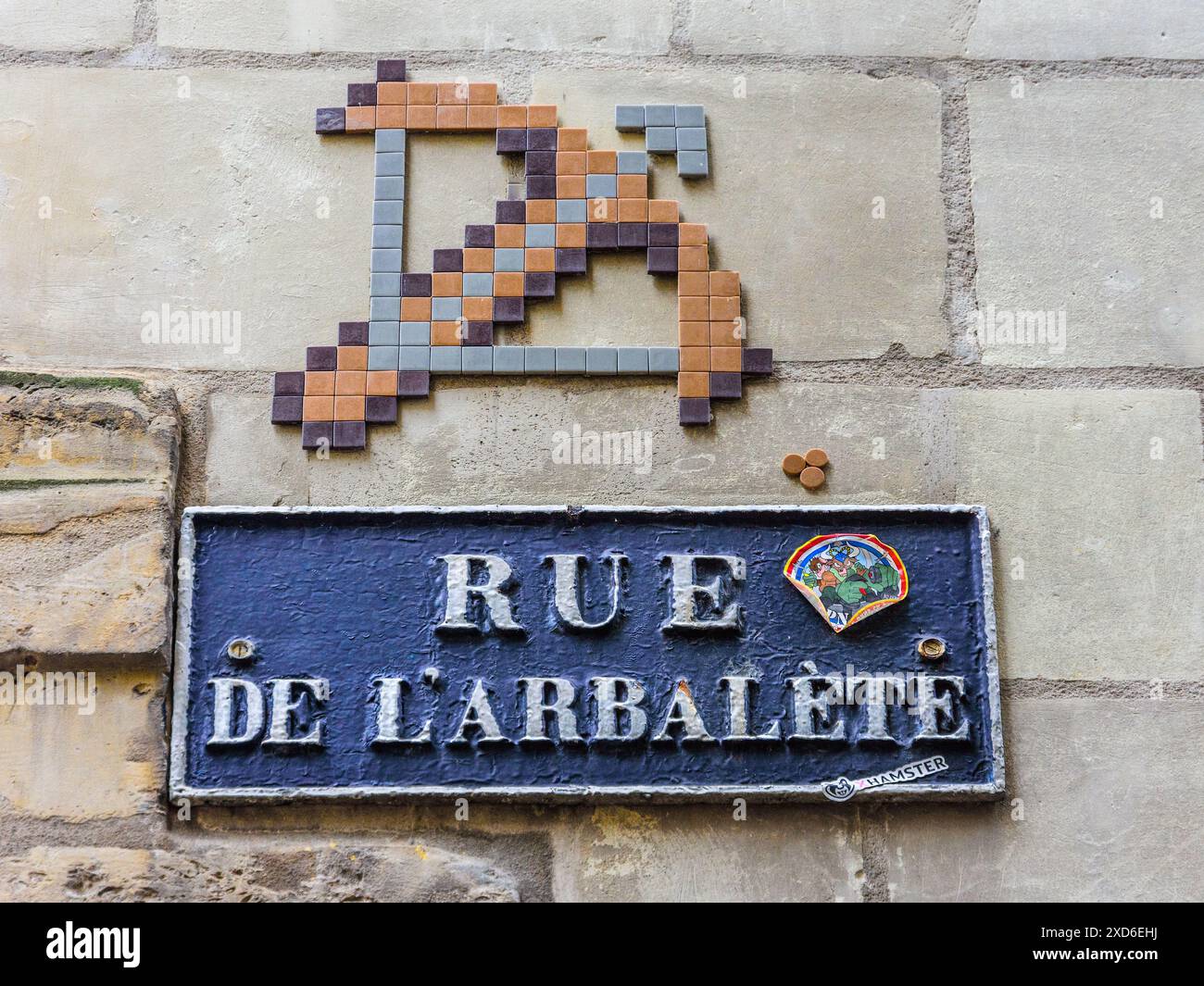 Tiled mosaic crossbow logo by famous artist known as Invader above Rue ...