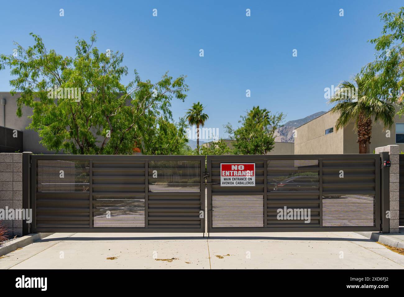 Gate at entrance to gated residential community Stock Photo - Alamy