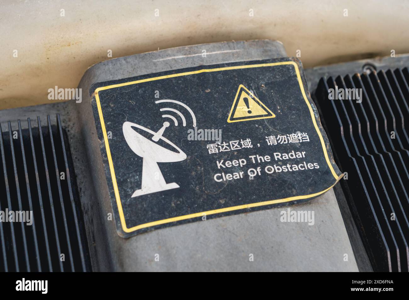 A closeup of a radar warning sign sticker on the drone, with a ...
