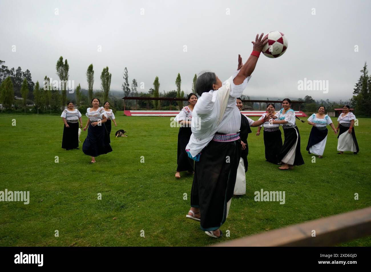 Indigenous women fight for the ball during a "handball with anaco ...