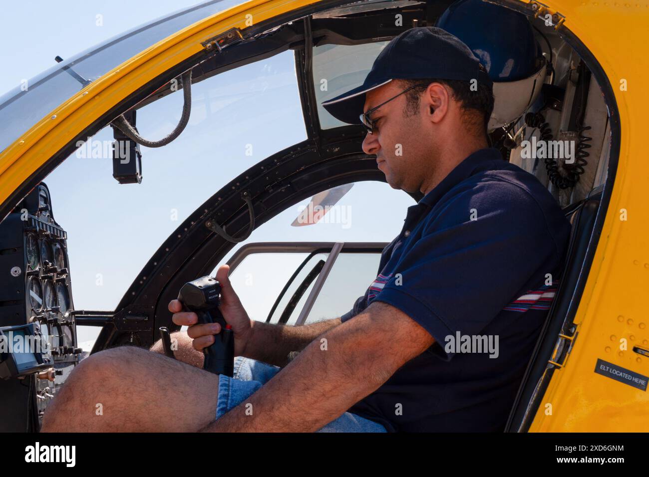 helicopter Arab pilot, flying a rescue chopper, wearing helmet and ...