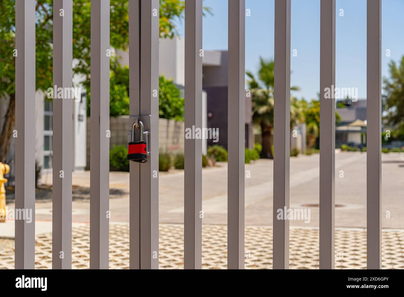 Gate at entrance to gated residential community Stock Photo - Alamy