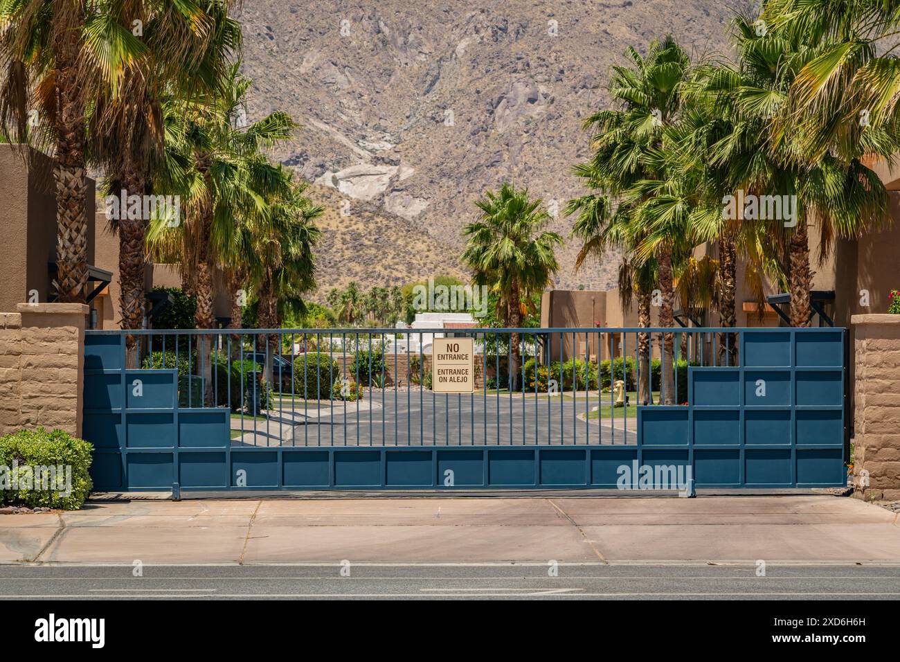 Gate at entrance to gated residential community Stock Photo - Alamy