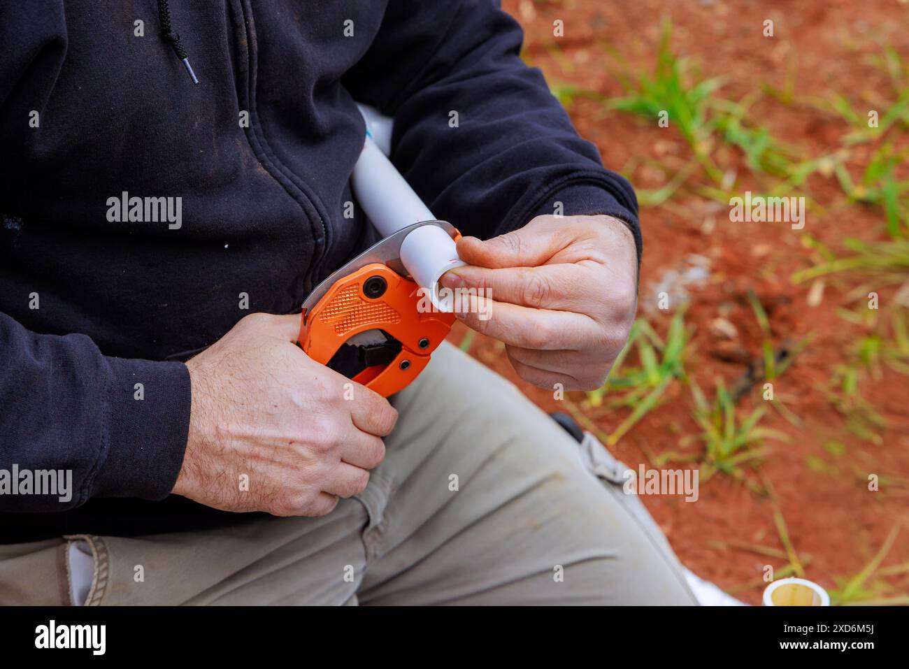 Water pipes are cut using special scissors by plumbers when they are ...