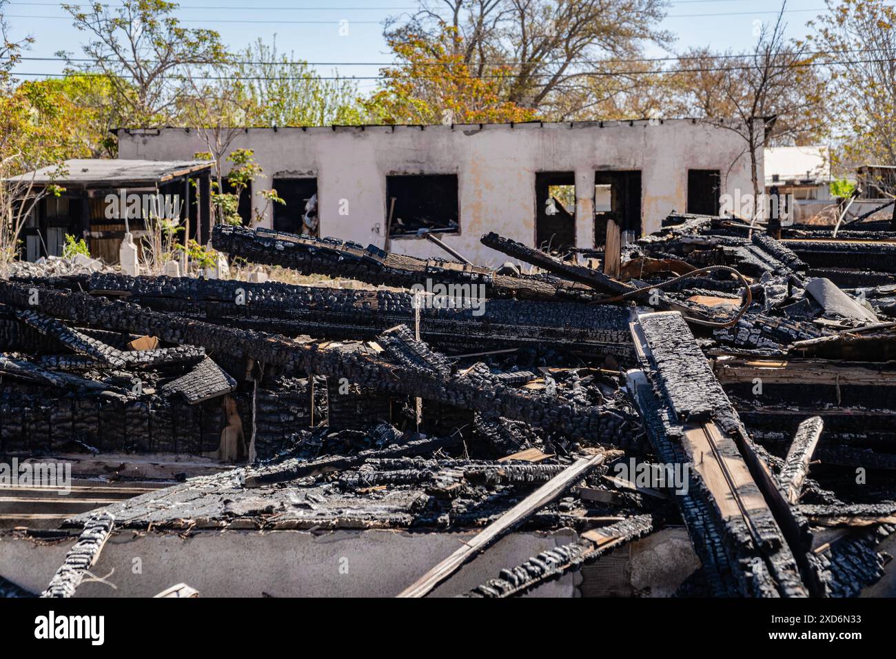 Remnants of burned building with black embers Stock Photo - Alamy