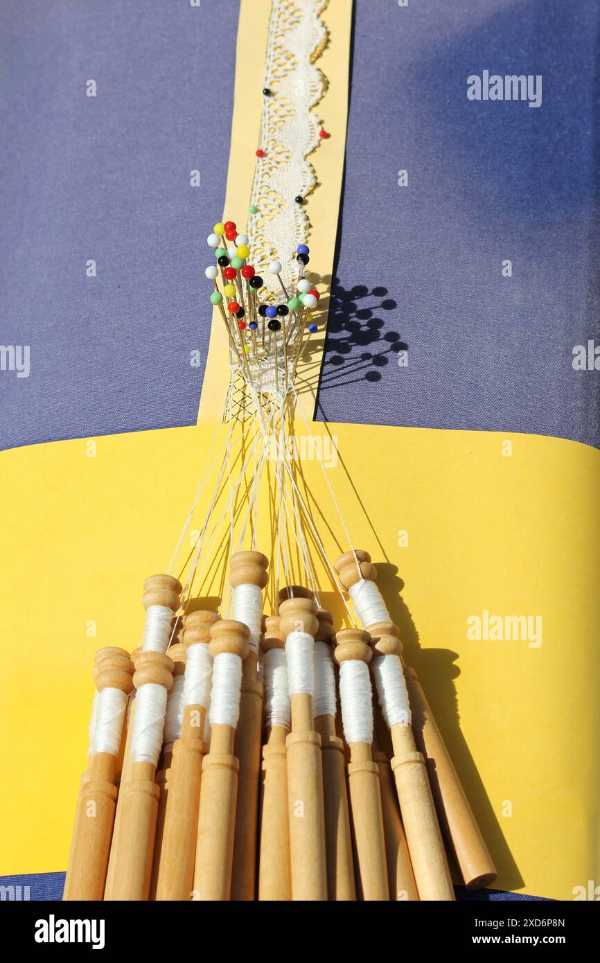 handmade handicrafts, bobbin lace in the process of handmade production ...