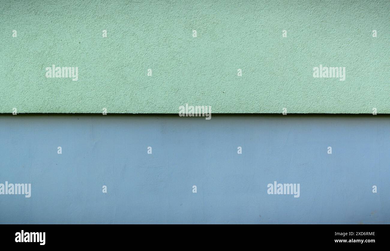 The walls are made of cement, painted in two colors: top green, bottom ...