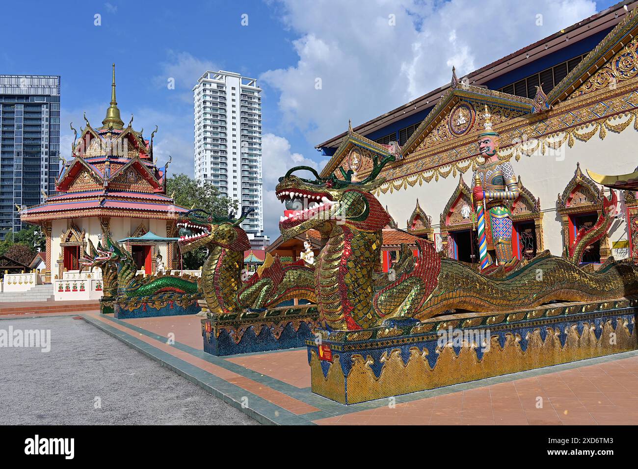 Ornate dragon & naga serpent sculptures at entrance to main prayer hall ...