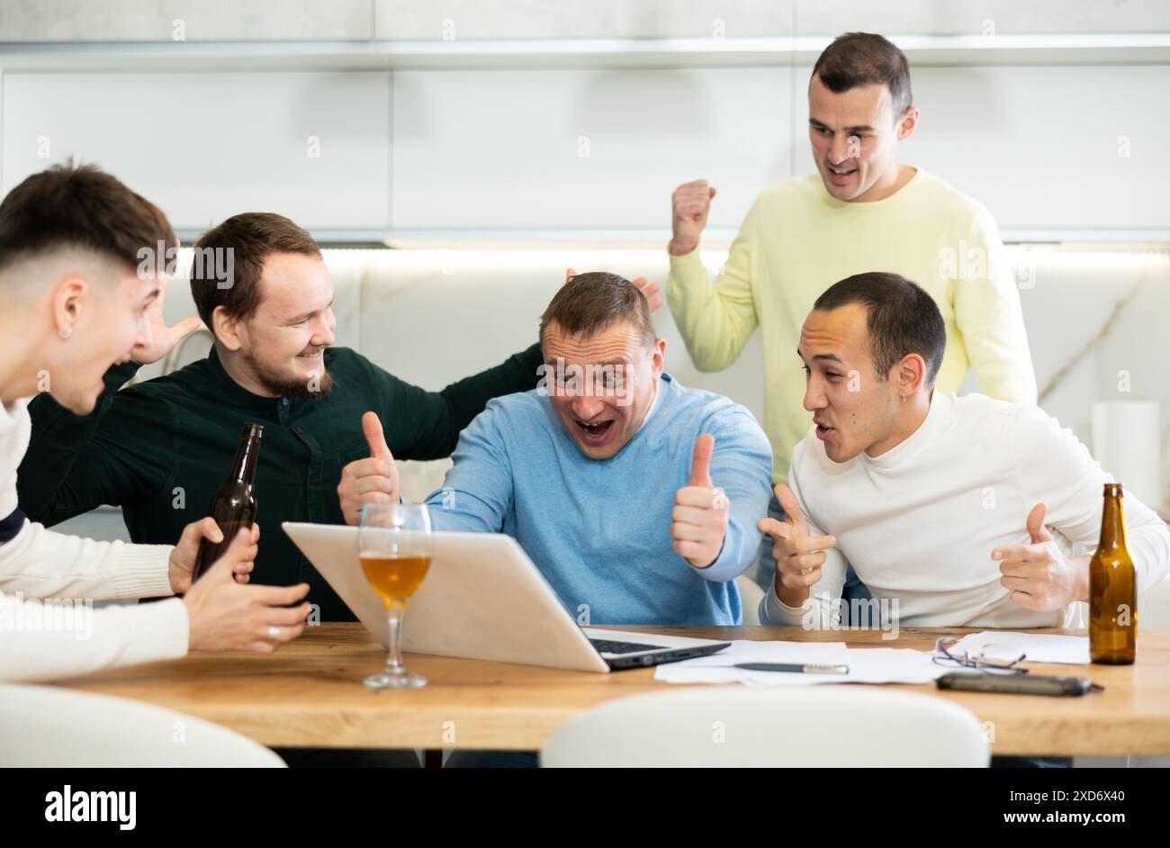 Happy male friends exulting after successful virtual investment Stock ...