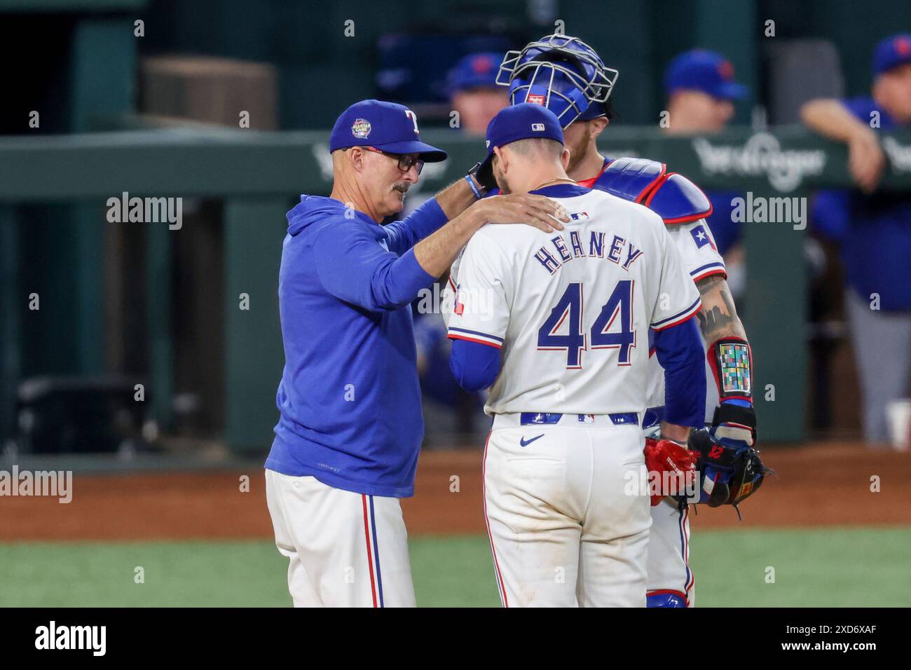 June 19, 2024: Texas Rangers pitching coach Mike Maddux (31) confers ...