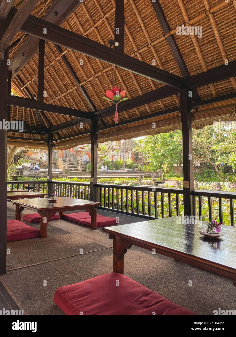 Traditional Bali style outdoor cafe in Ubud with view on lotus pond ...