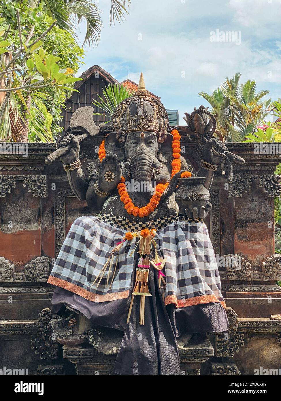 Ganesha with balinese Barong masks sitting on front of temple ...