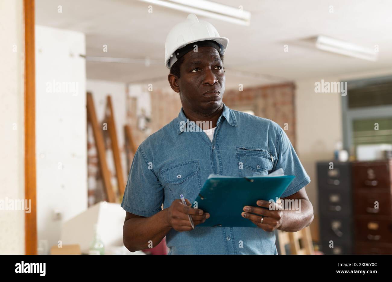 Responsible engineer with papers conducting inspection of construction ...