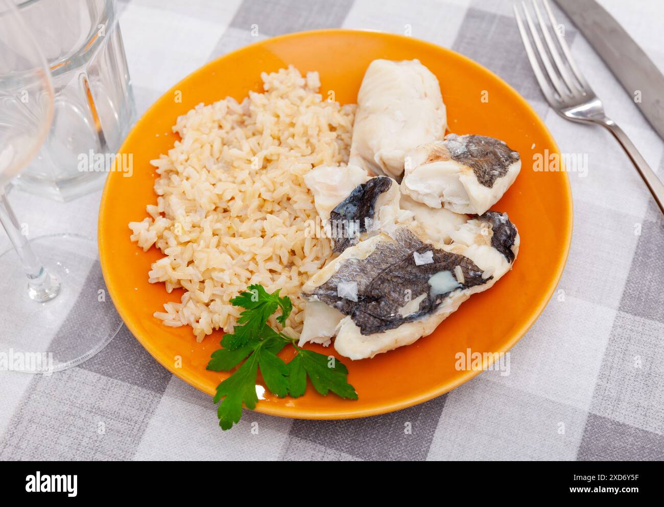 Baked cod fillets with basmati rice and fresh parsley Stock Photo - Alamy