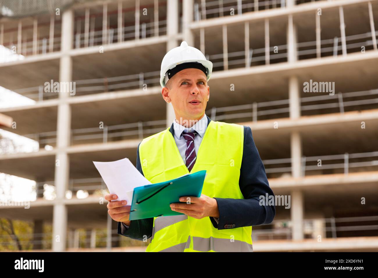 Engineer checking building documentation hi-res stock photography and ...