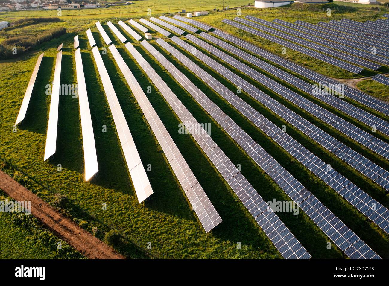 Picturesque scene of solar panels neatly aligned in grassy field ...