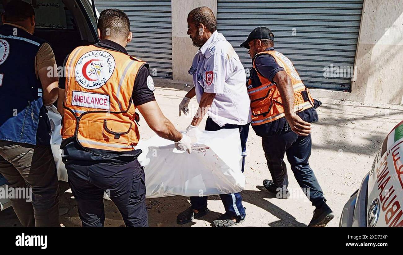 Palestinian emergency personnel transports the victim after an Israeli ...