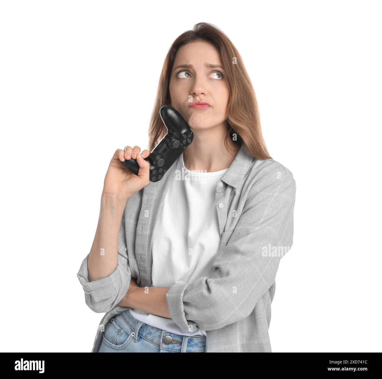 Sad woman with game controller on white background Stock Photo - Alamy