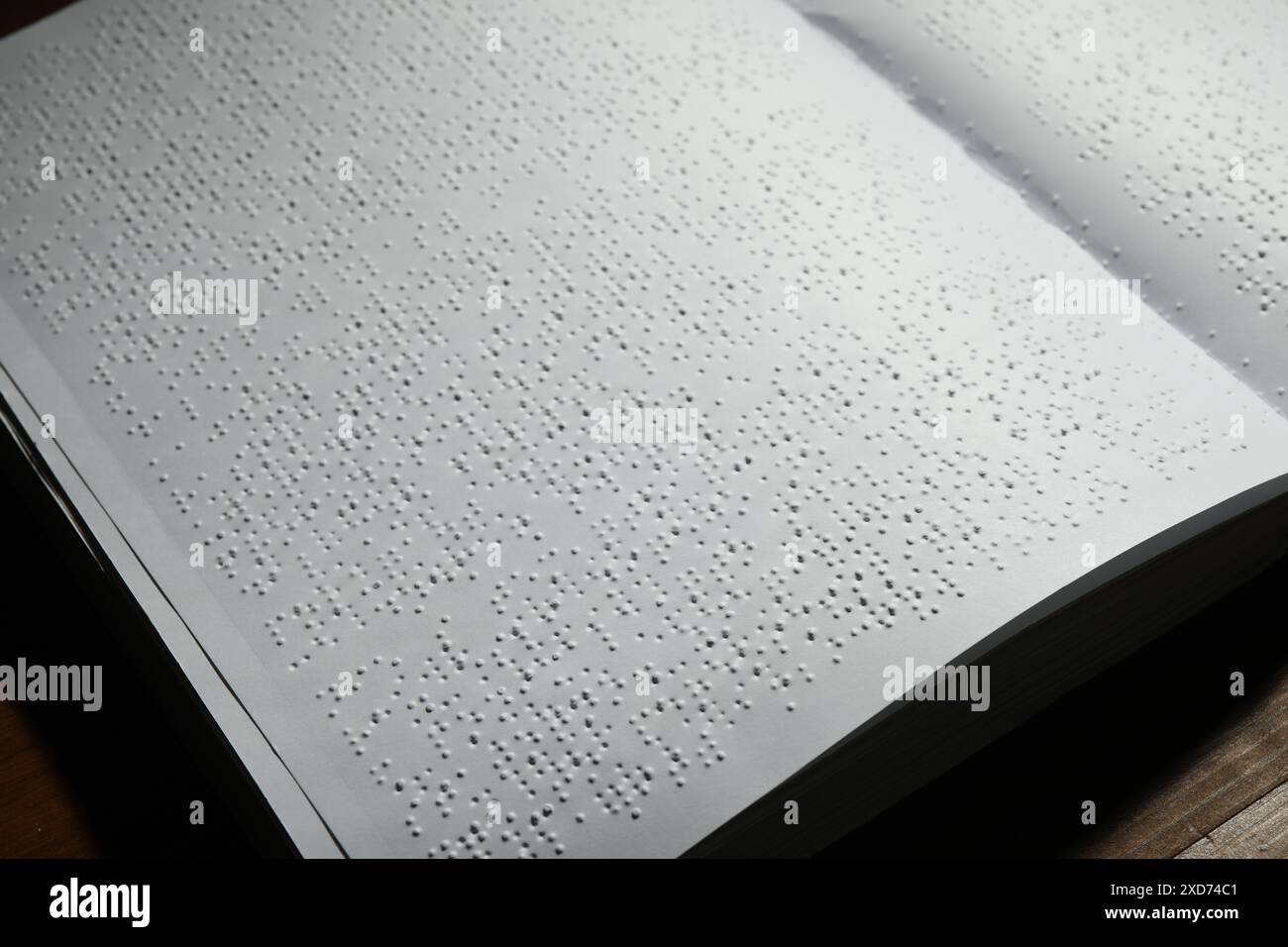 Book with Braille text on table, closeup. Education and leisure for ...
