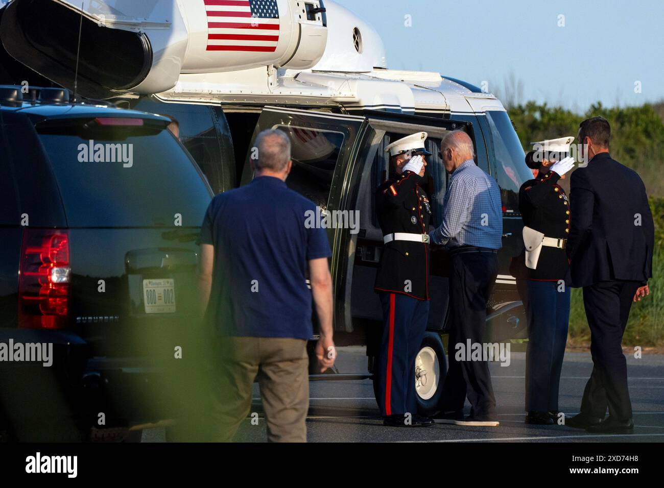 President Joe Biden boards the Marine One helicopter at Gordons Pond ...