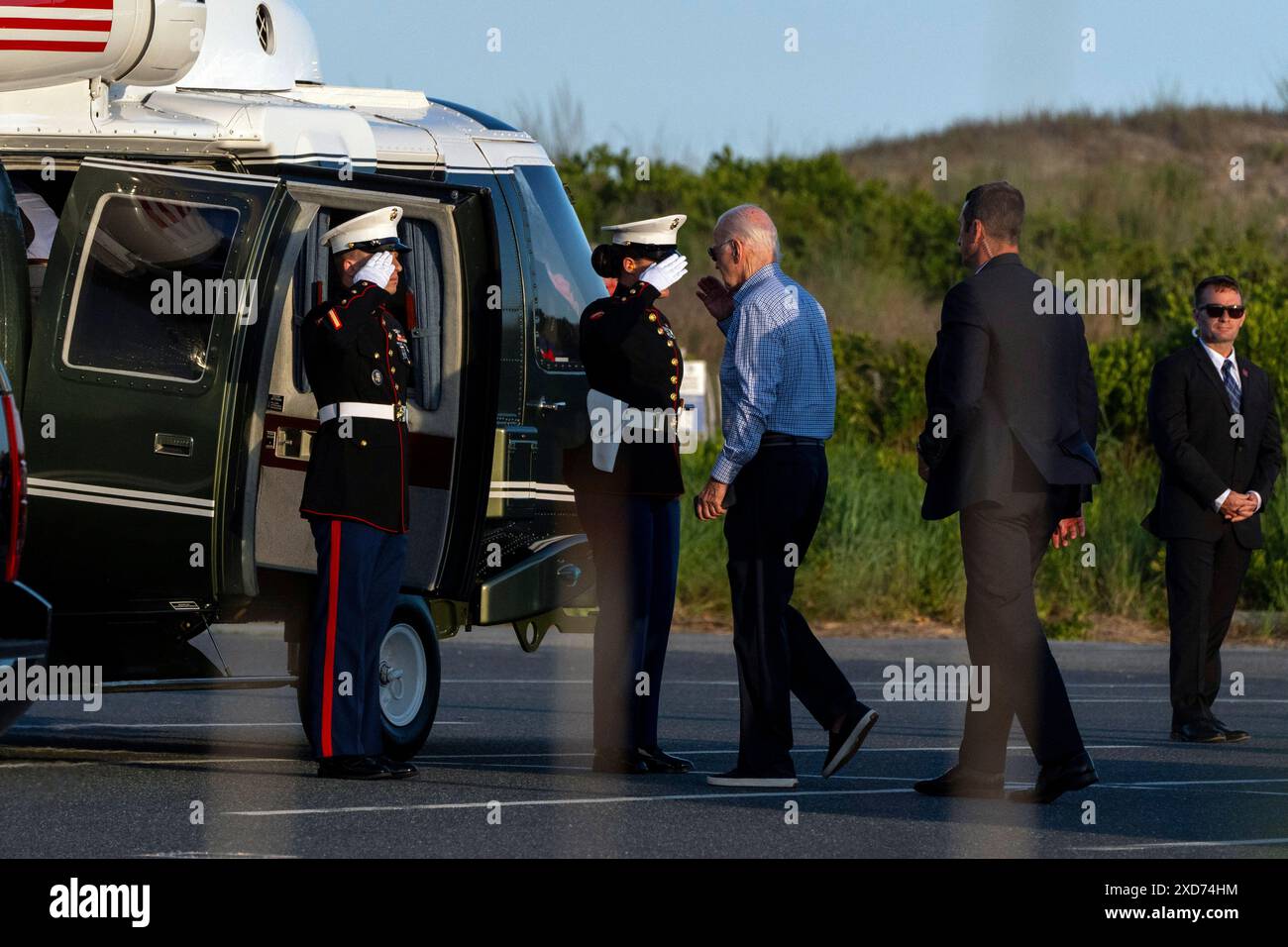President Joe Biden boards the Marine One helicopter at Gordons Pond ...