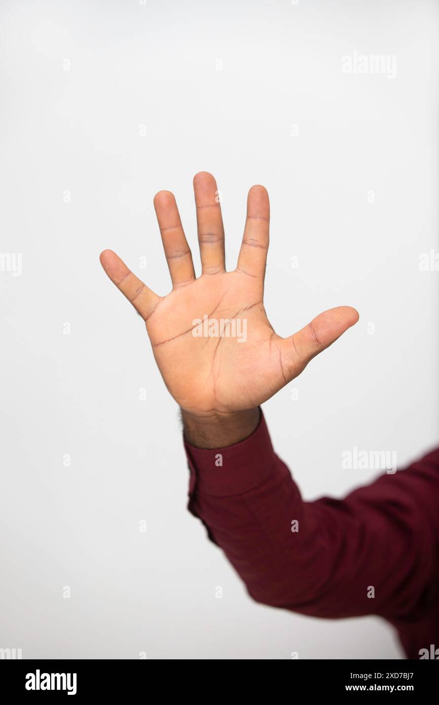 say no hand gesture. black Hand in long sleeves making stop sign ...