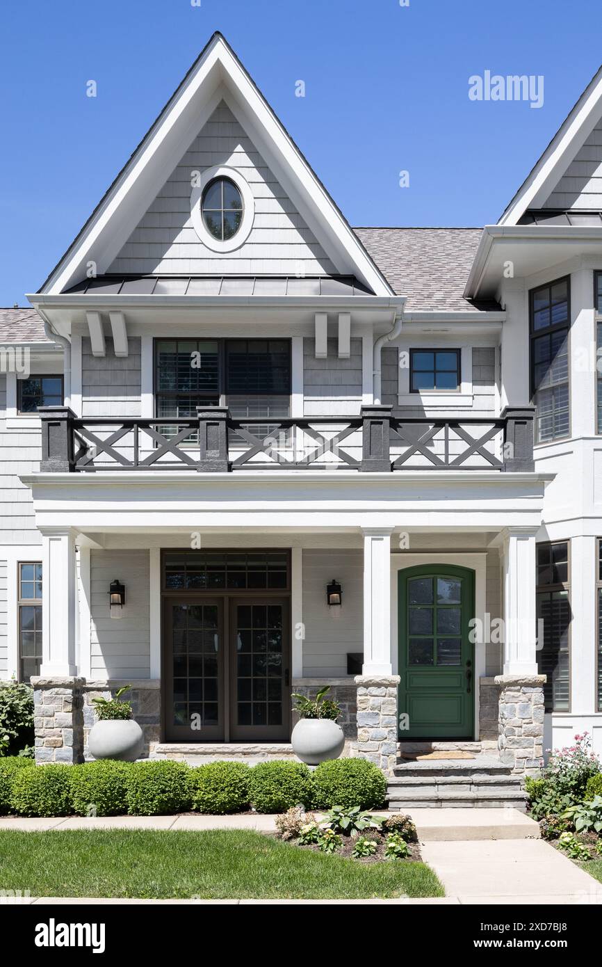 A luxury white and grey modern farmhouse entryway detail with a covered ...
