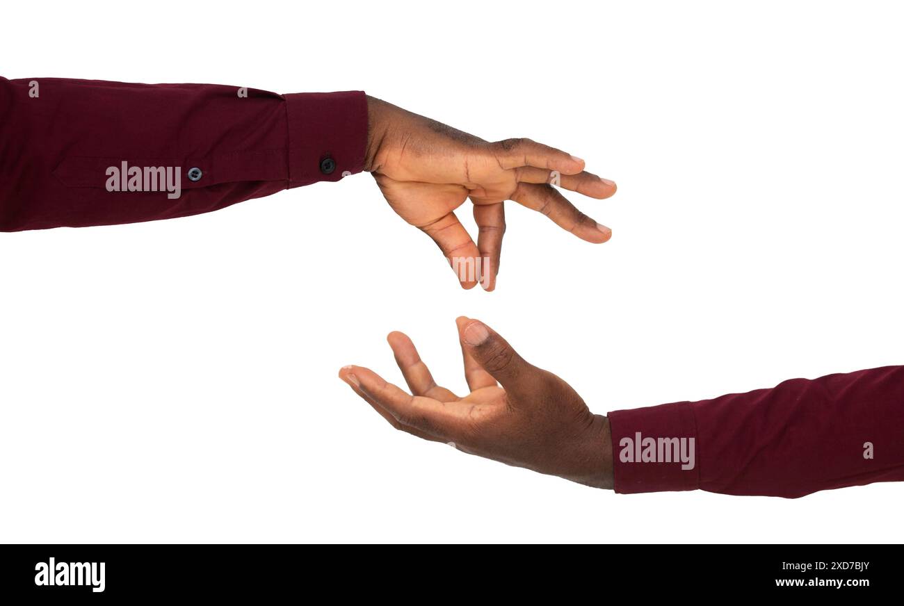 two black Hands in long sleeves shirt making ging and receiving ...