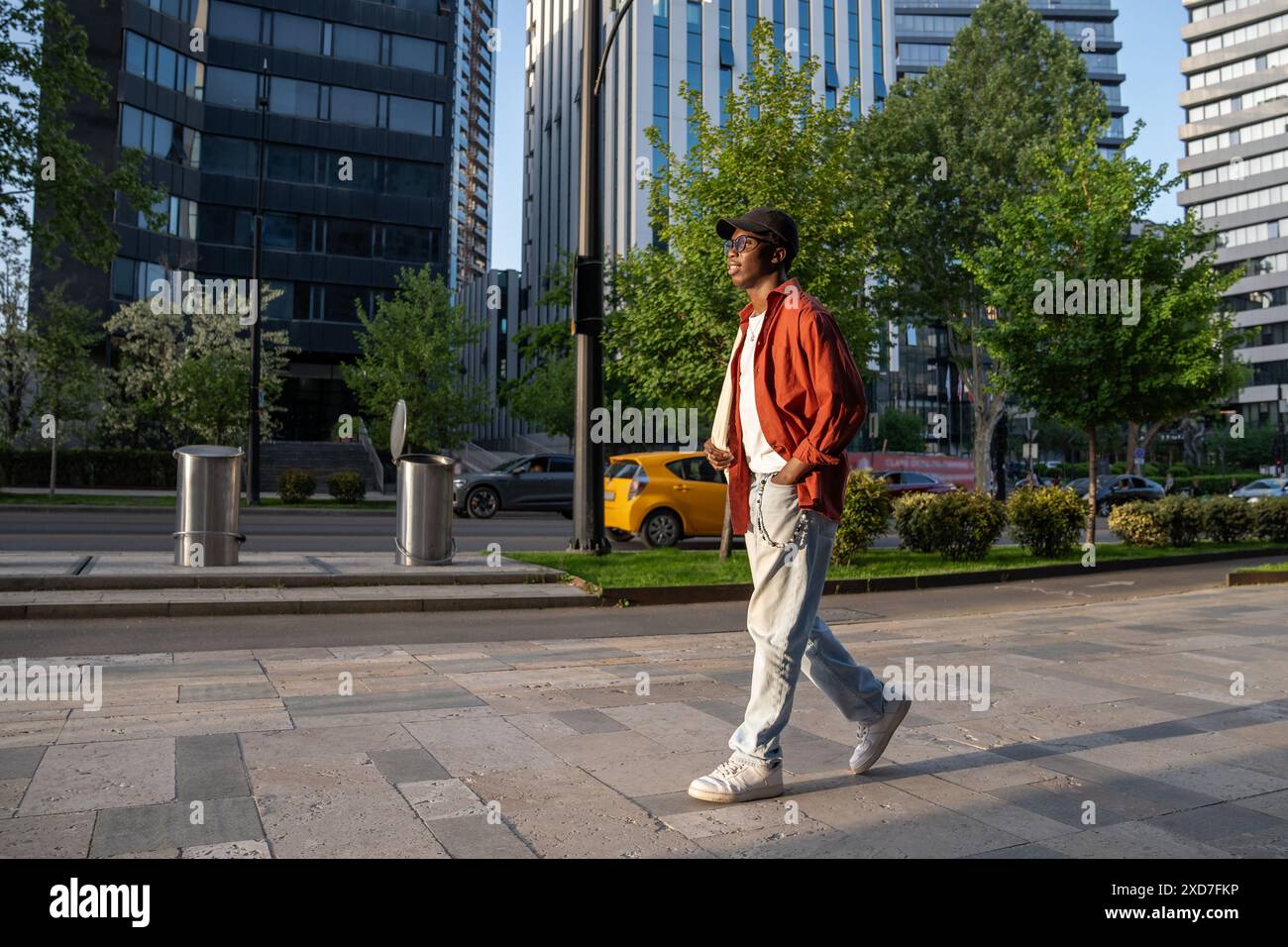 Relaxed African American guy on peaceful quite stroll around town, man ...