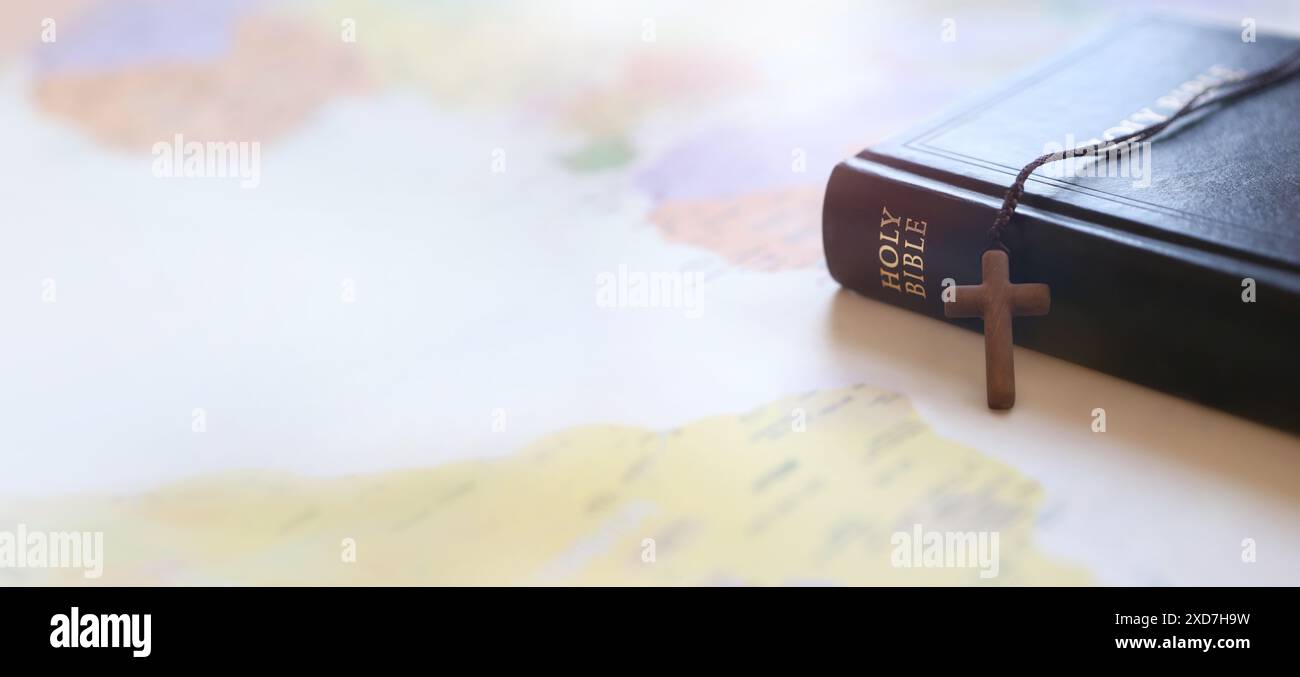 Holy cross of Jesus Christ, Bible book, world map background and ...